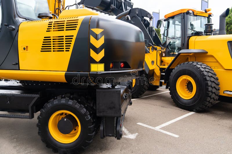 Fleet of Yellow Construction Machines Stock Image - Image of excavator ...