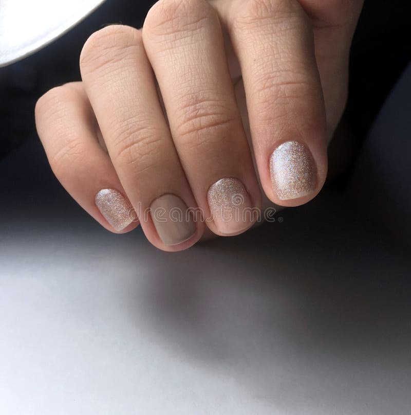Flesh-colored Beautifull Manicure on Nails. Female Manicure Stock Photo ...