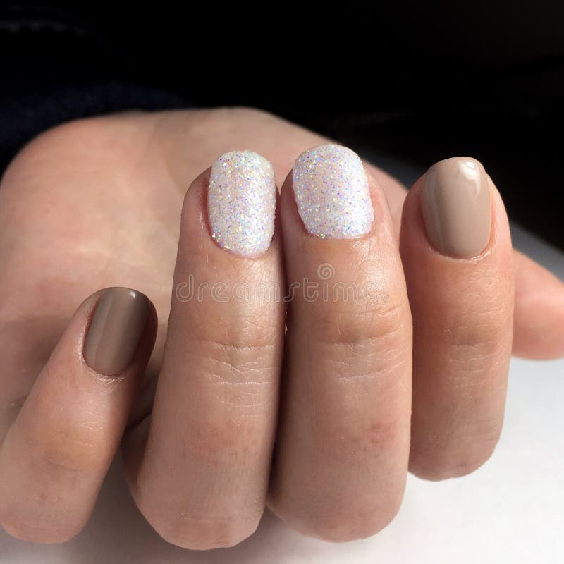 Flesh-colored Beautifull Manicure on Nails. Female Manicure Stock Photo ...