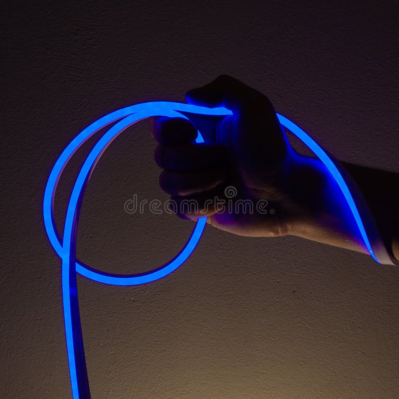 Flexible Blue Led Tape Neon in Hand on Black Background Stock Photo ...