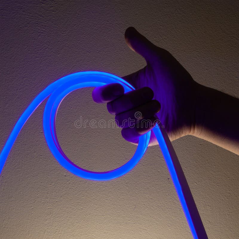 Flexible Blue Led Tape Neon in Hand on Black Background Stock Image ...