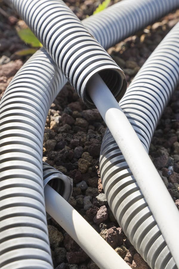 Flexible Plastic Pipe with Electric Cable Coming Out from the Ground ...