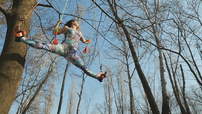 Flexible Woman Make a Split on Hanging Ropes Stock Footage - Video of ...