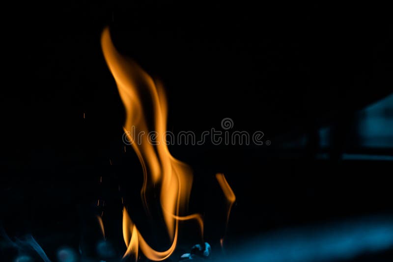 A Flickering Flame of a Hot Fire Isolated on Black Background Stock ...