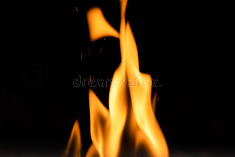 A Flickering Flame of a Hot Fire Isolated on Black Background Stock ...