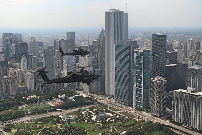 A Flight of Apache Helicopters Fly Over Downtown Chicago Editorial ...
