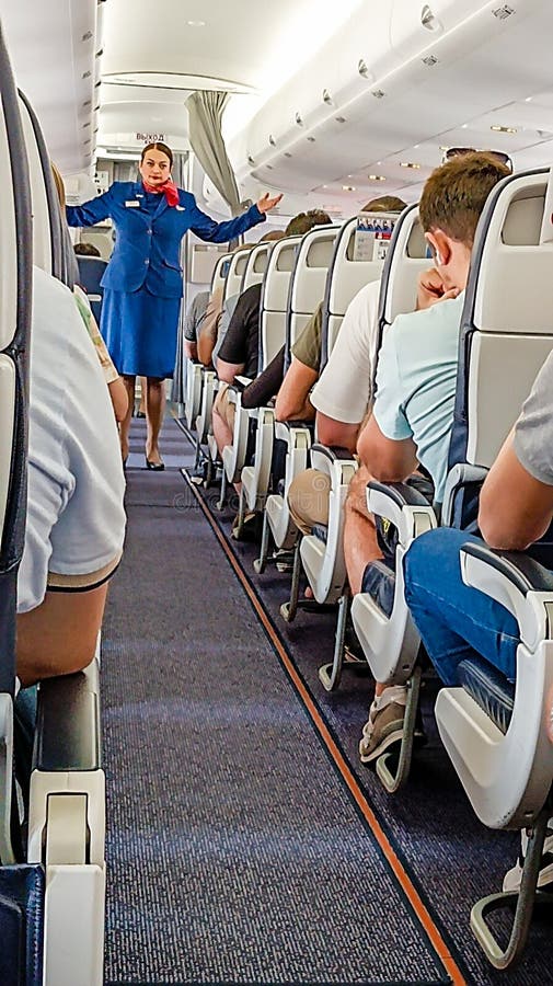 Flight Attendant Instructing Passengers before Takeoff Editorial Stock ...