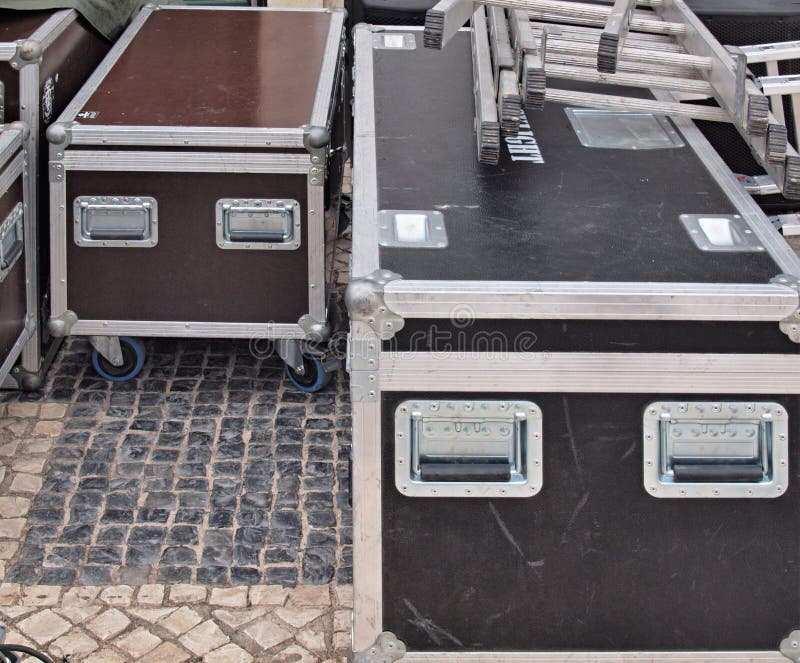 Flight Cases and Aluminum Ladders Laying on Cobblestone Street Stock ...