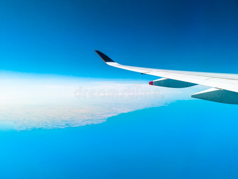 Airplane in clear blue sky stock image. Image of flight - 199770099
