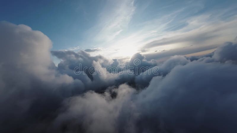 Flight between the Clouds, First-person View of the Aircraft during the Flight at Sunset ...