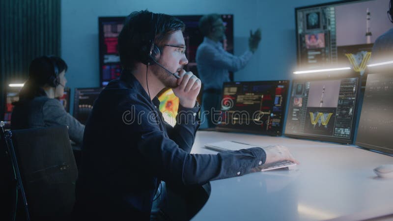 Portrait of Flight Control Operator in Command Center Stock Footage ...