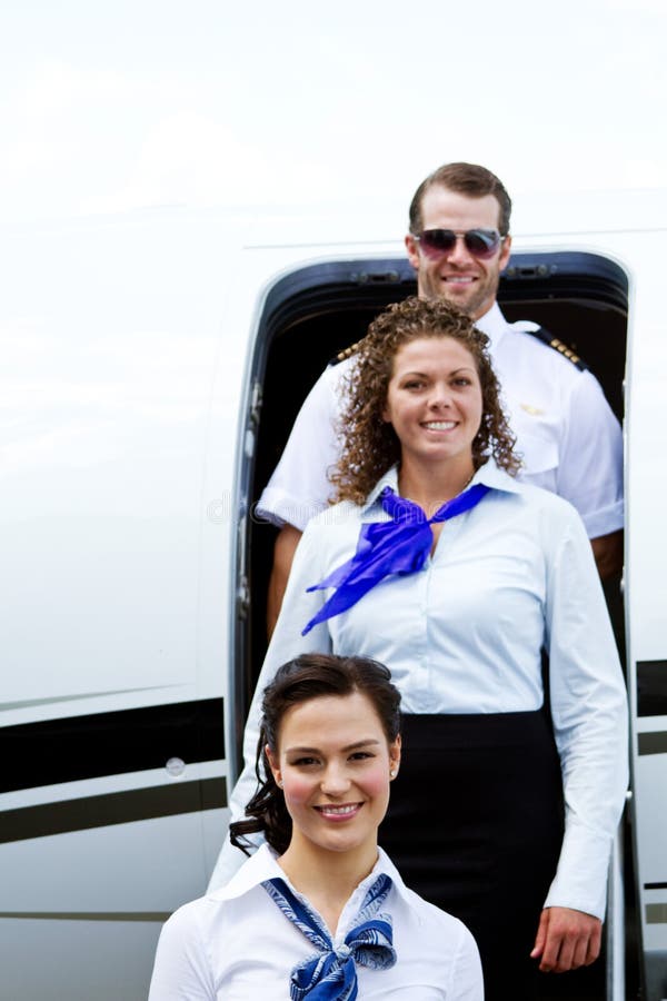Flight crew exiting plane stock image. Image of friendly - 48049807