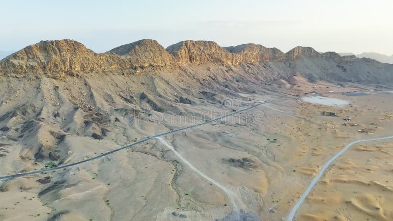 Drone Over a Rocky Ridge among the Sandy Desert Stock Footage - Video ...