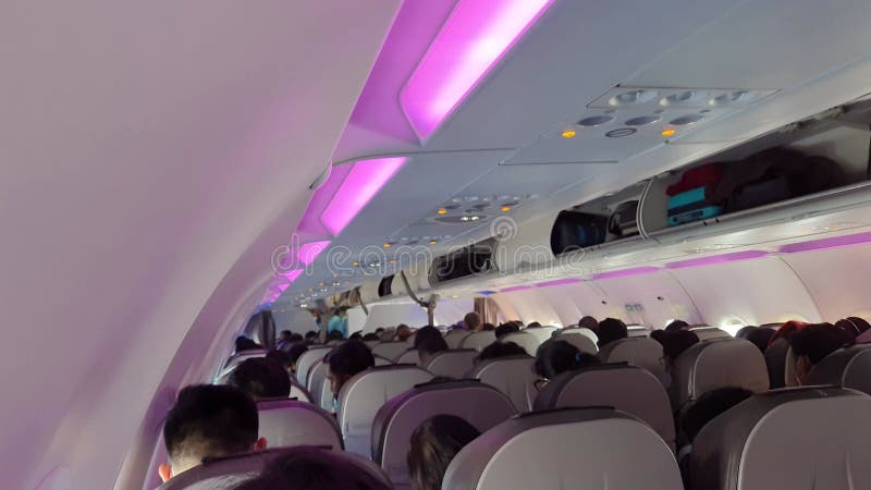 Flight Inside View Filled with Passengers on Board from Different Angle ...