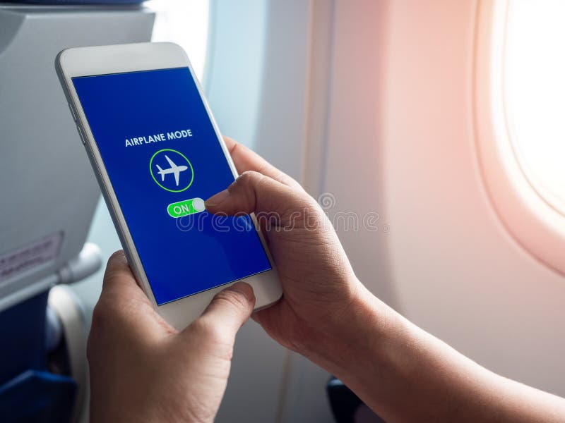Flight Mode Concept. Hand Holding White Smartphone and Turned on ...