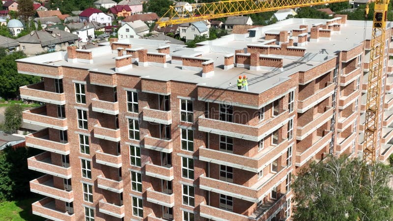 A Flight Over a High-rise Red Brick Building with Inset Windows without ...