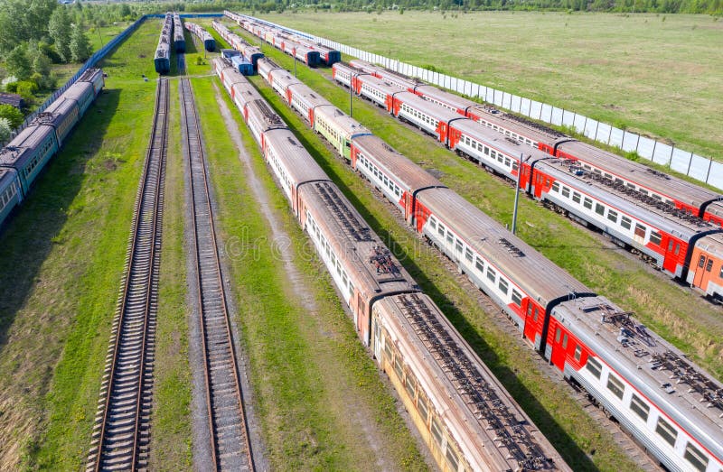 Flight Over Passenger Trains at Railway Station on a Summer Day Stock ...