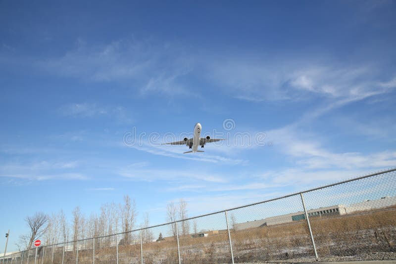 Airplane Flight in the Blu Sky Over the Road Stock Photo - Image of ...