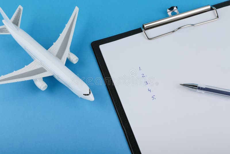 Flight Planning Concept. Plane, Diary and Pen on a Blue Background ...