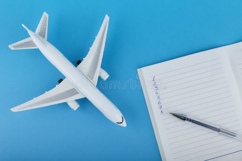 Flight Planning Concept. Plane, Diary and Pen on a Blue Background ...
