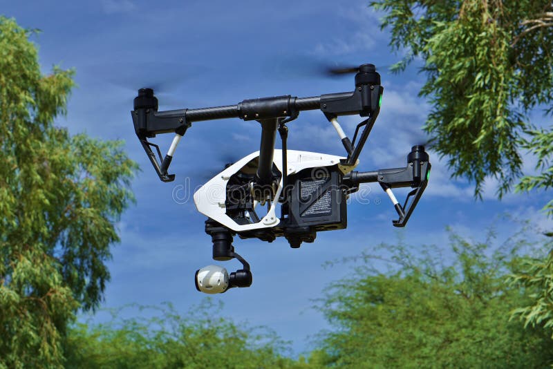 In Flight - Side View of Professional Camera Drone (UAV) Stock Image ...