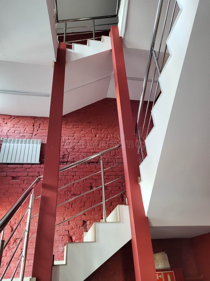 A Flight of Stairs with Red Walls, Looking Up when Viewed from Below ...