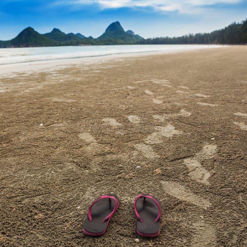 Flip-flop on sand beach stock image. Image of atoll, panoramic - 71456603