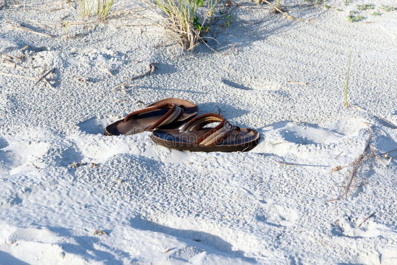 Flip flops on beach sand stock image. Image of coastline - 78317757