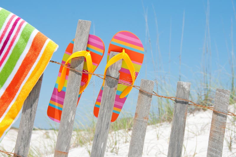 Flip flops on fence stock image. Image of cockel, summer - 19433915