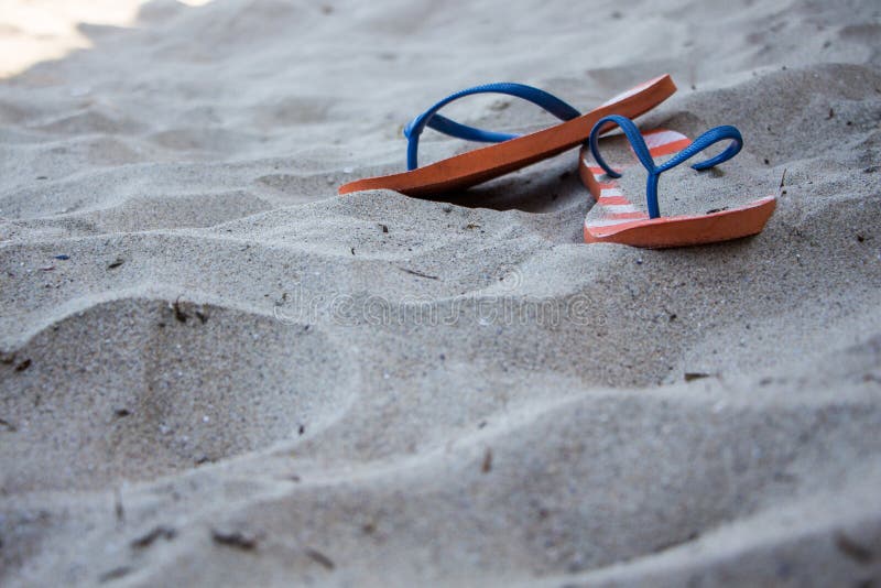 Flip flops in sand. stock image. Image of leisure, flops - 134512703