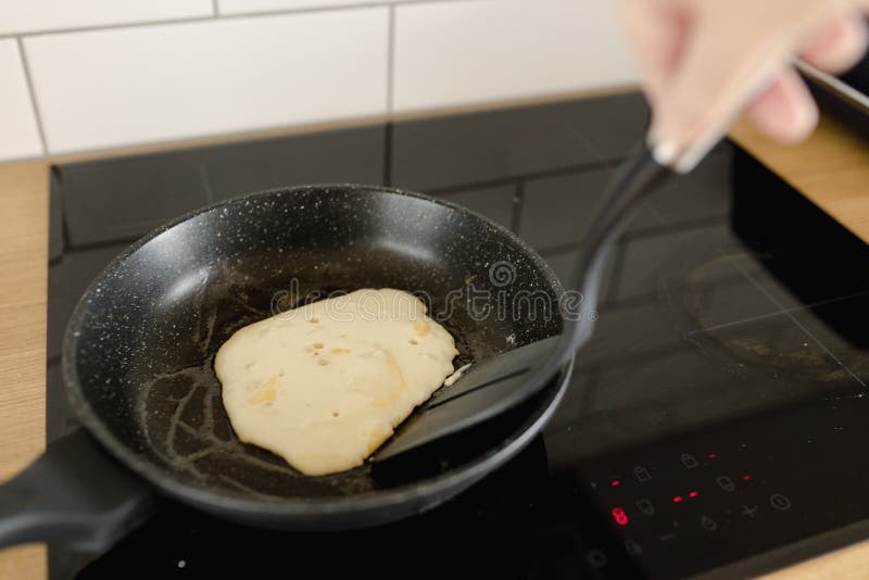 Flipping a pancake stock photo. Image of ready, preparation - 255586050