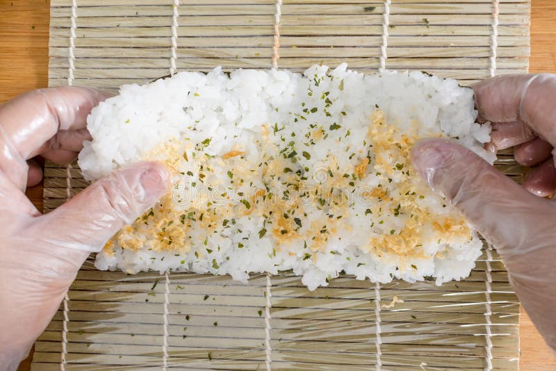 Flipping Seasoned Short Grain Rice on a Makisu. Making Sushi Rolls ...