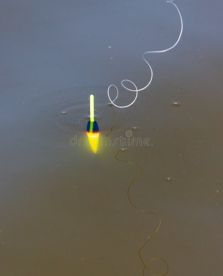 Float for Fishing on the Surface of the Water in the Pond Stock Photo ...