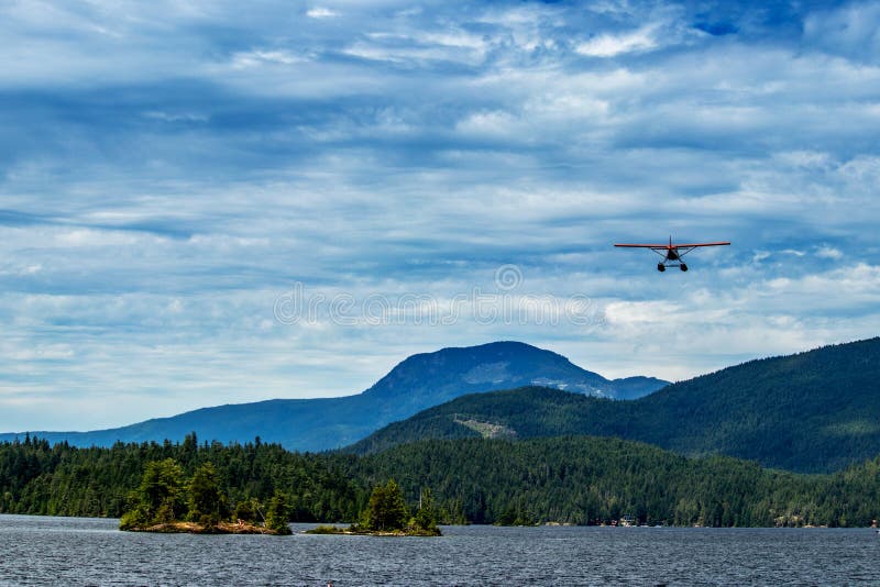 Float Plane Flying Above Ruby Lake, Sunshine Coast, BC, Canada Stock ...
