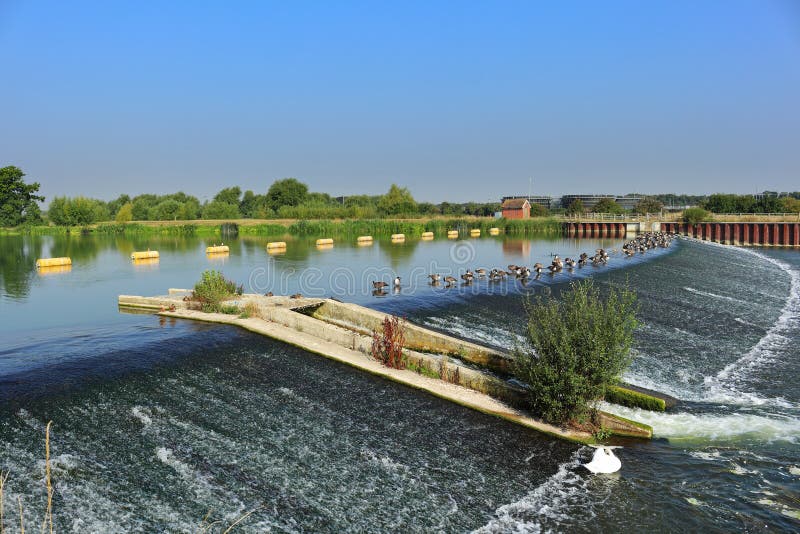 Floating Barrier on a Tranquil Blue River Stock Image - Image of ...