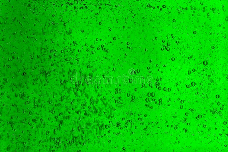 Floating Bubbles in Green Liquid Background Texture. Stock Photo ...