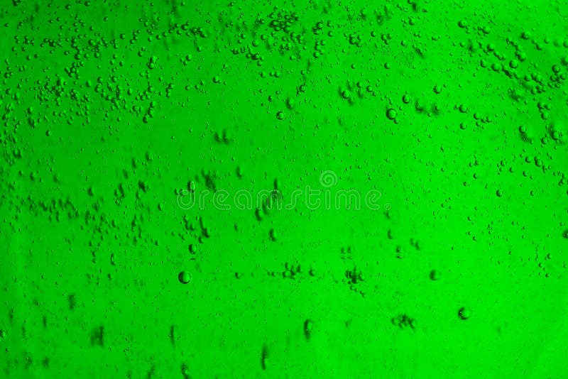 Floating Bubbles in Green Liquid Background Texture. Stock Photo ...