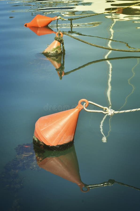 Floating buoy on ropes stock image. Image of design, abstract - 43111917