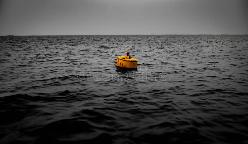 The floating buoy at sea stock photo. Image of guide - 193664586