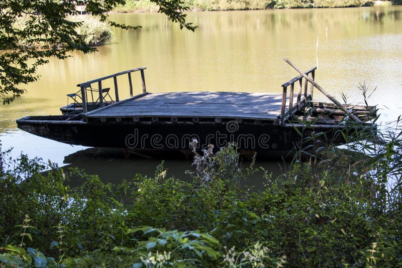 The Floating Cable Bridge 1 Stock Image - Image of loading, boats ...