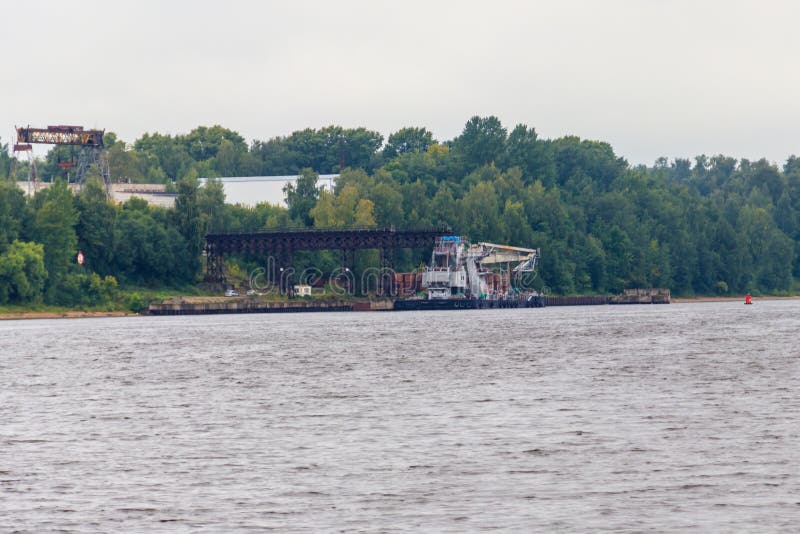 Floating Construction Crane on Platform Near the Shore of the Volga ...