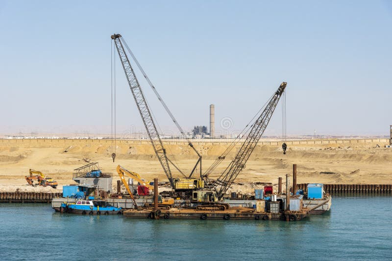 Floating Cranes Berthed at the Bank of the Suez Canal. Stock Photo ...