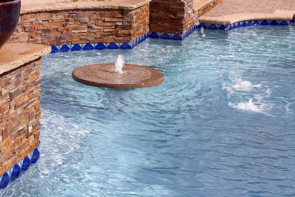 Floating Fountain within a Swimming Pool Stock Photo - Image of level ...