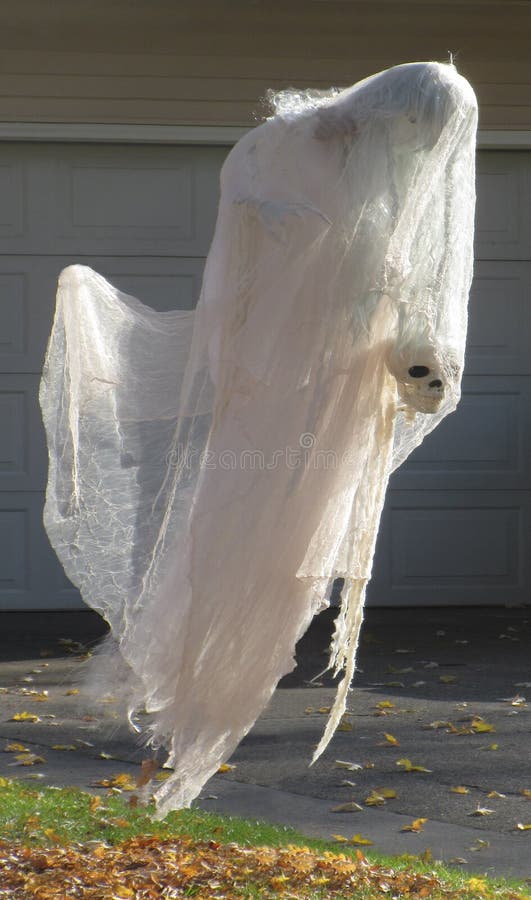 Floating Ghost in White Carrying a Human Skull Stock Photo - Image of ...
