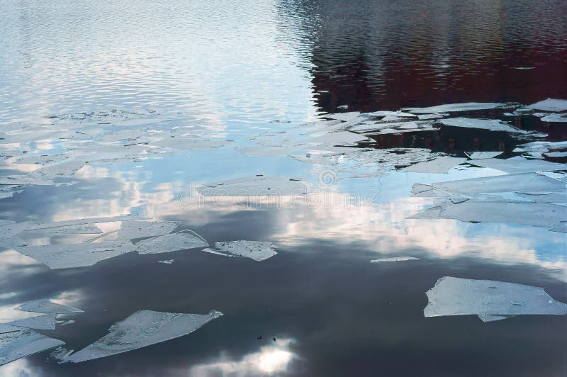 Floating Ice, Reflection of the Sun and Clouds from the Ice Stock Photo ...
