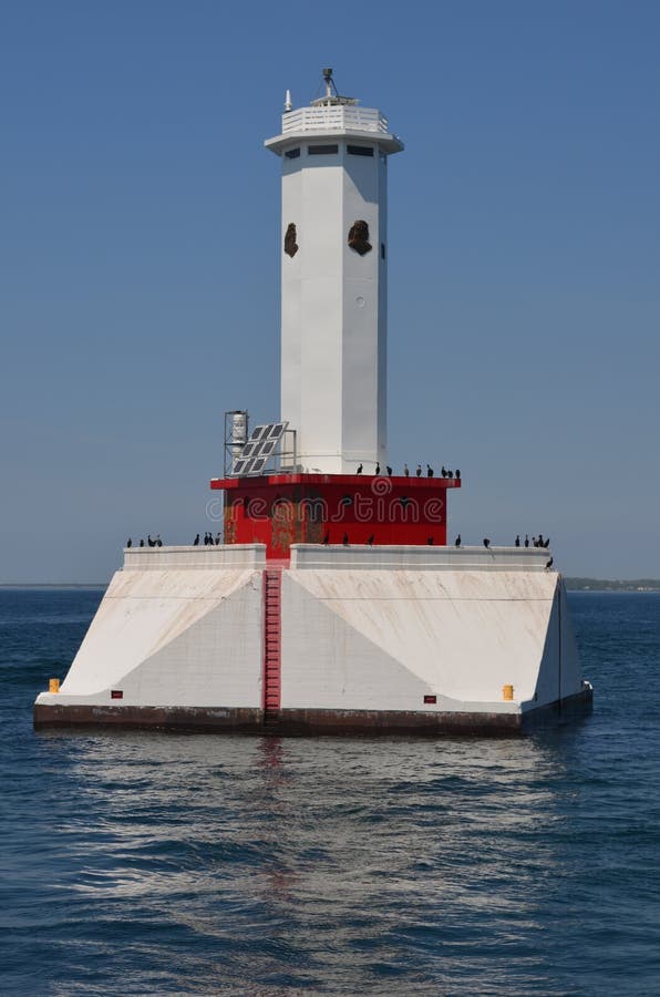 Floating Lighthouse and Sailboat Stock Image - Image of experience ...