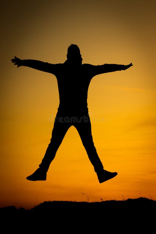 Floating man in sunset stock image. Image of flying - 179356093