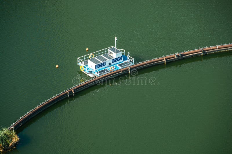 Floating Platform on a Green Lake with a Boat Editorial Stock Image ...
