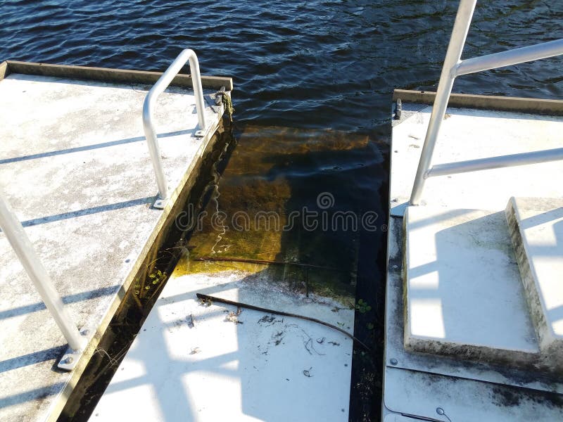 Floating Platform in Water with Algae and Railings Stock Photo - Image ...