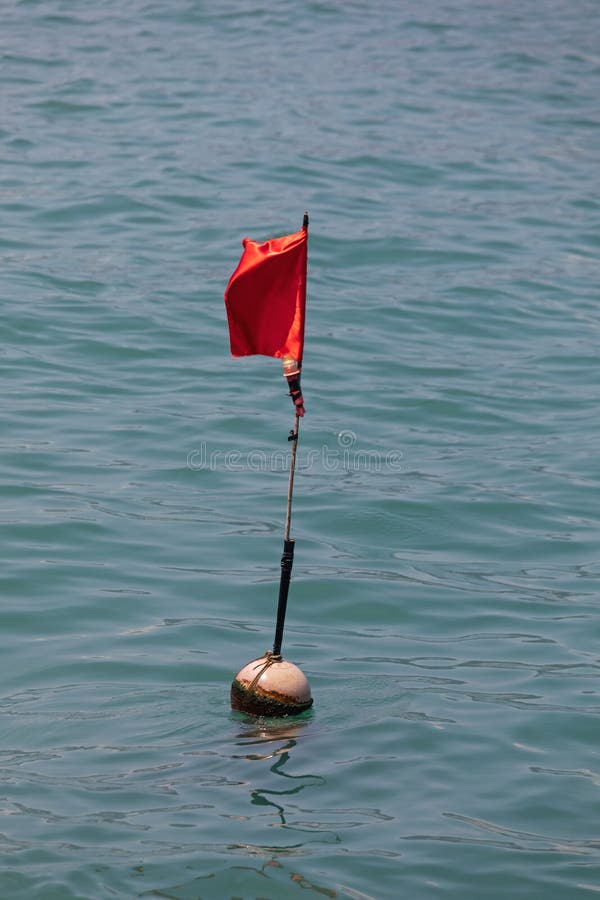 Floating Red Flag stock image. Image of safety, flag - 162990323